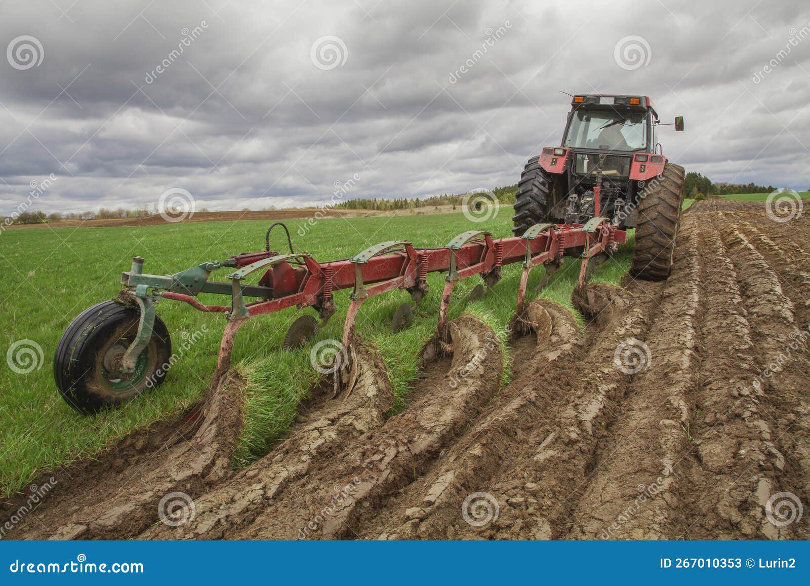 Plowing, Ploughing in the Fields on a Dark Cloudy Spring Day. Stock ...