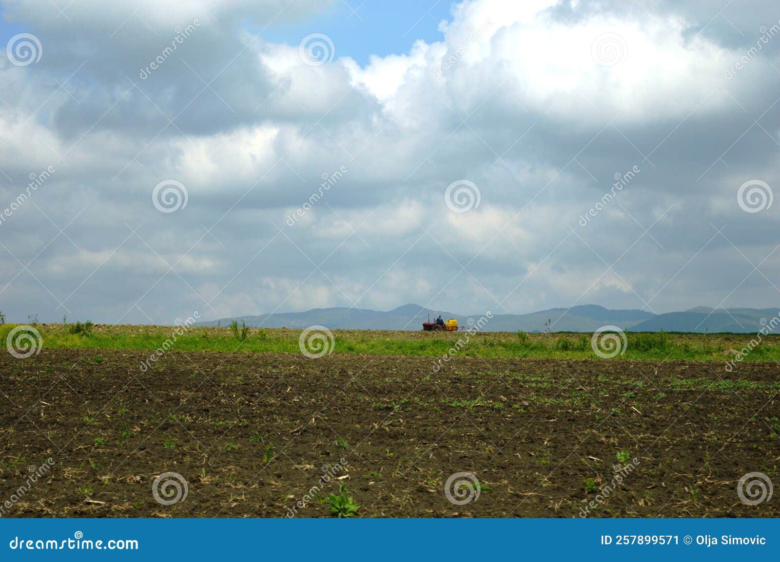 Plowman on a Tractor in the Distance Stock Image - Image of tractor ...