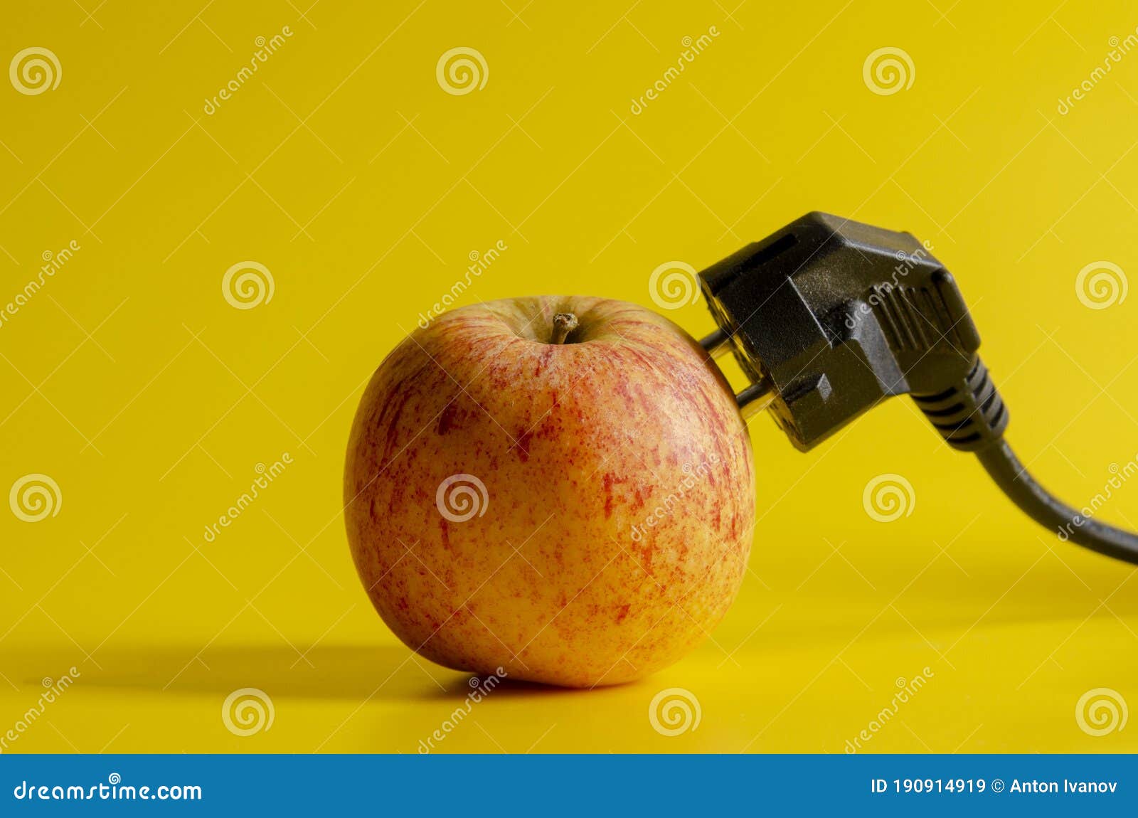 The Plug Gets Energy from a Fresh Apple. Energy Concept Stock Image ...