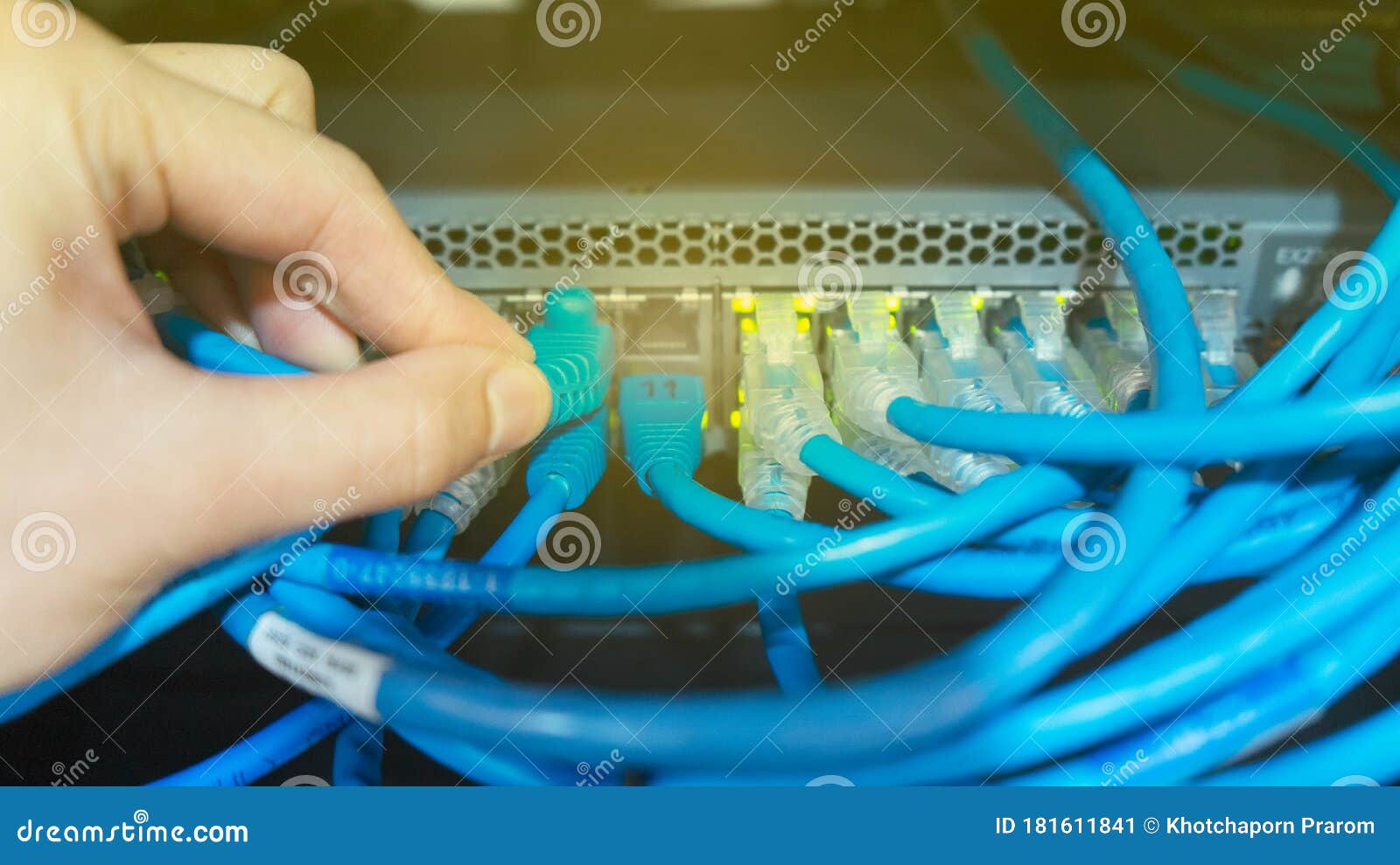 Plug LAN Cable or RJ45 into Network Switch on Data Center Technology a ...