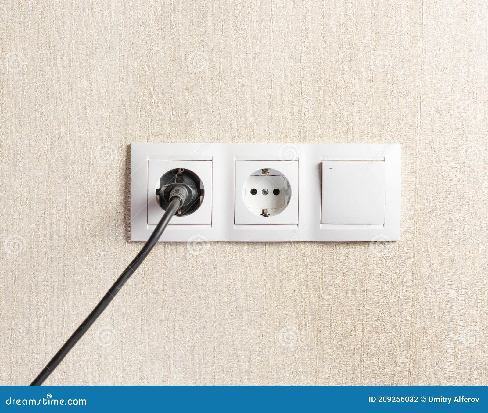 The Plug is Plugged into an Electrical Outlet on the Wall Stock Photo ...