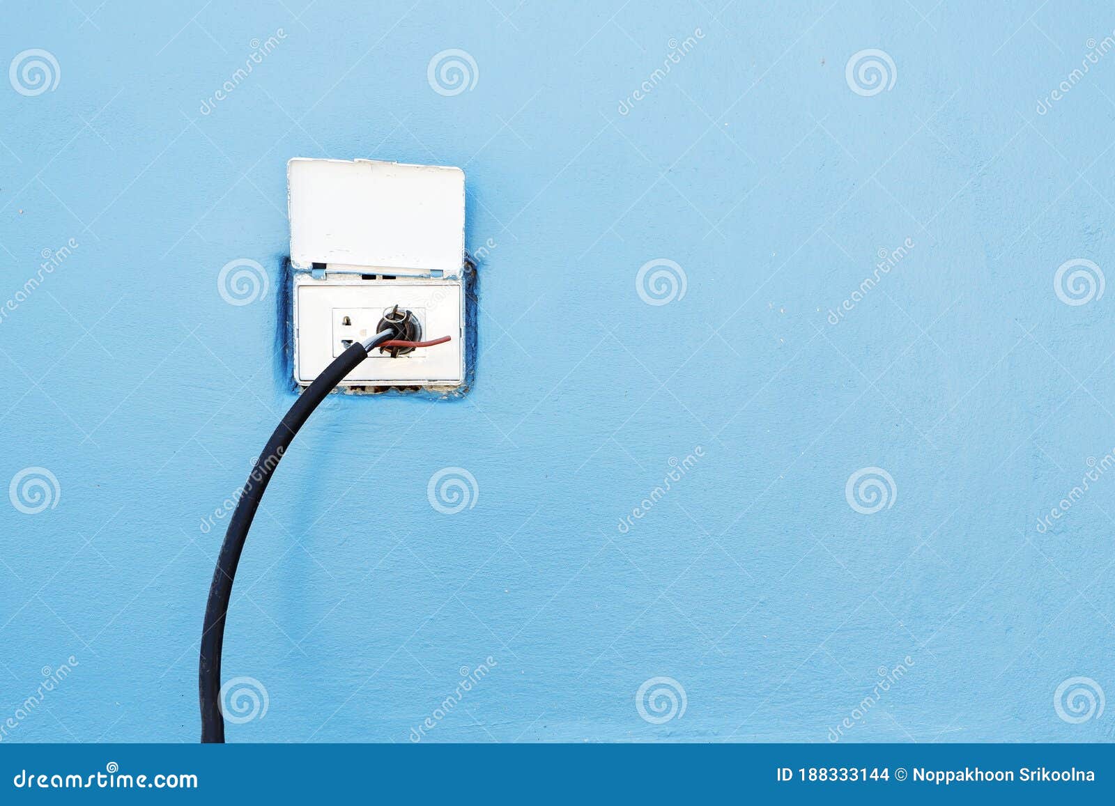 The Plug is Plugged into a Wall Outlet at Outside of House Stock Photo ...