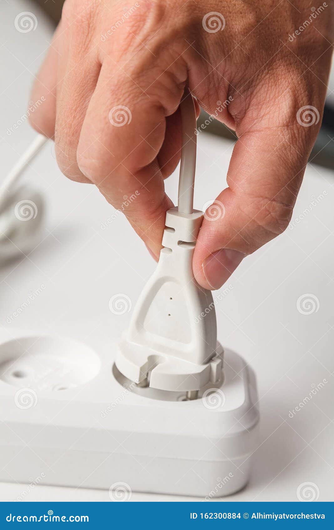 A White Extension Power Cord With A Very Long Cable For Construction ...