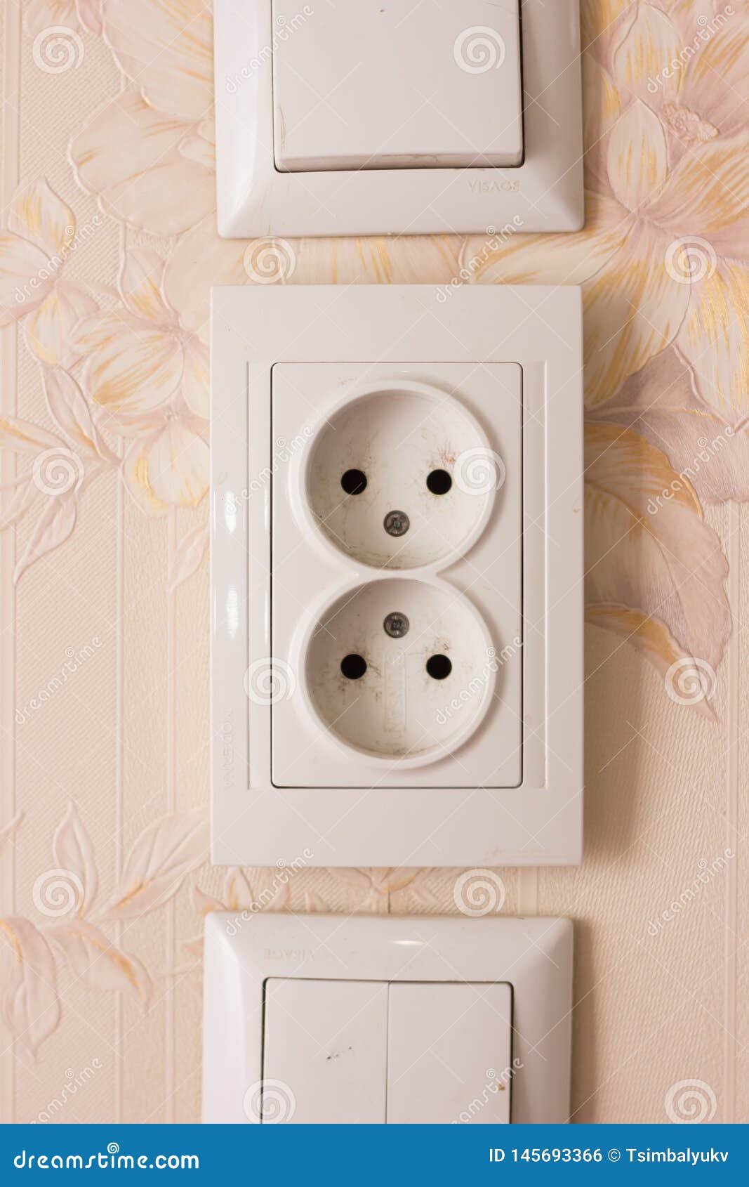 Plugging Electrical, Black Plug in Electric Socket on Wall. Stock Photo ...