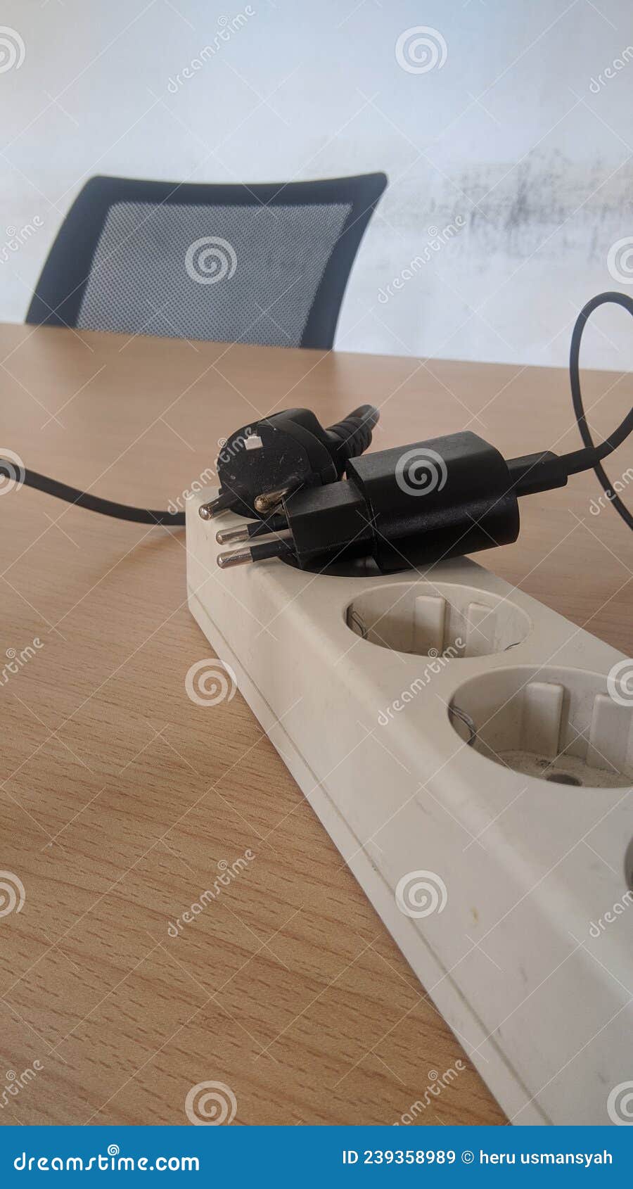 Plugging Electrical, Black Plug In White Electric Socket On Wall. Stock ...