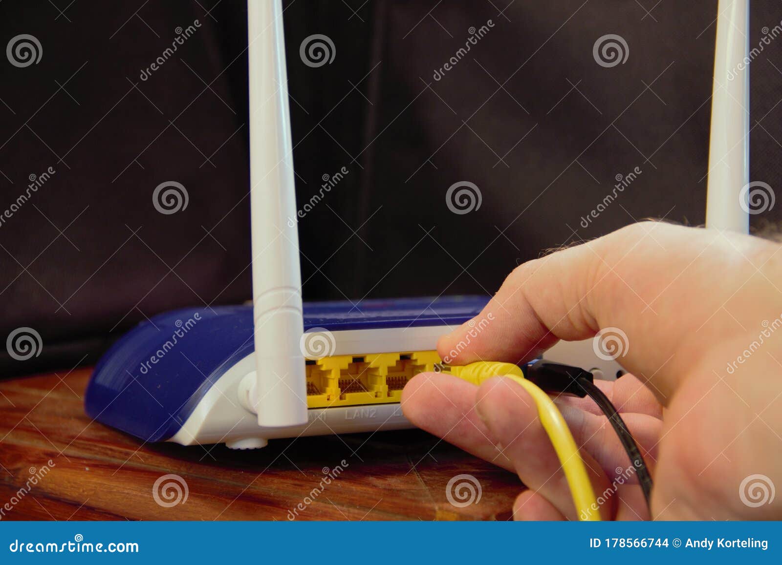 Plugging a Network Cable into a Wifi Router Stock Photo - Image of ...