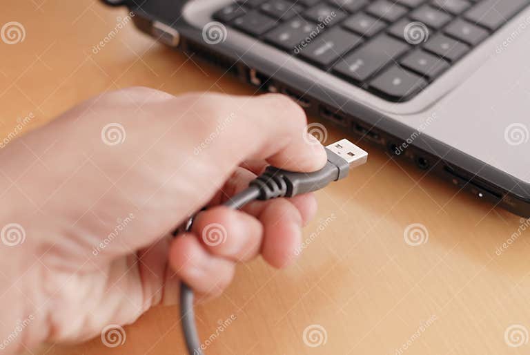 Plugging in the USB Cable stock photo. Image of digital - 22805118