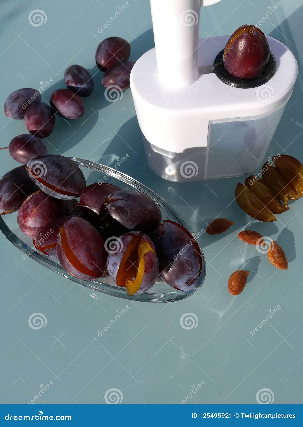 Plum pitter in action stock image. Image of plum, squeeze - 125495921