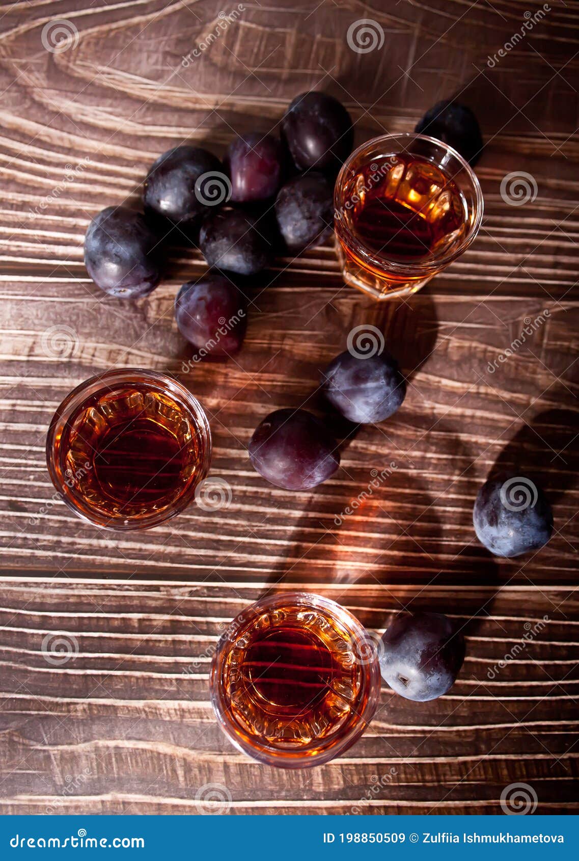 Plum Vodka or Brandy with Fresh Plums on the Wooden Table. Stock Image ...