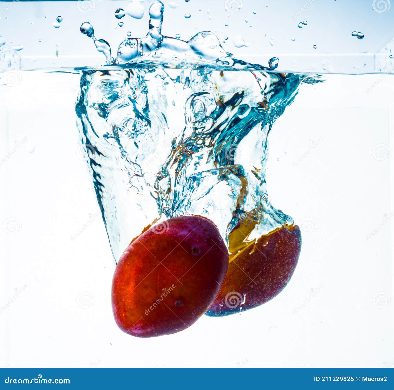 Plum in Water with Splash and Cut in Half Stock Image - Image of drip ...