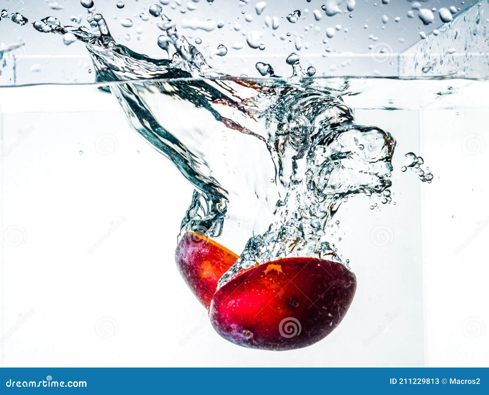 Plum in Water with Splash and Cut in Half Stock Image - Image of ...