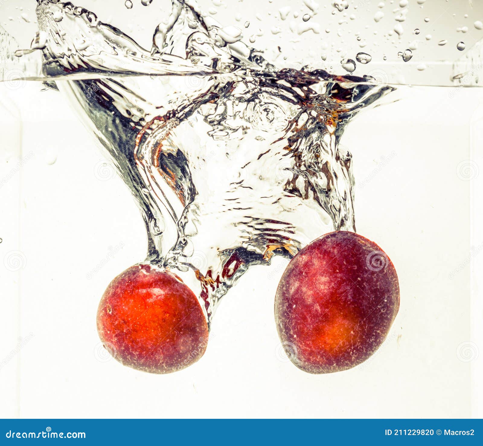 Plum in Water with Splash and Cut in Half Stock Photo - Image of ...