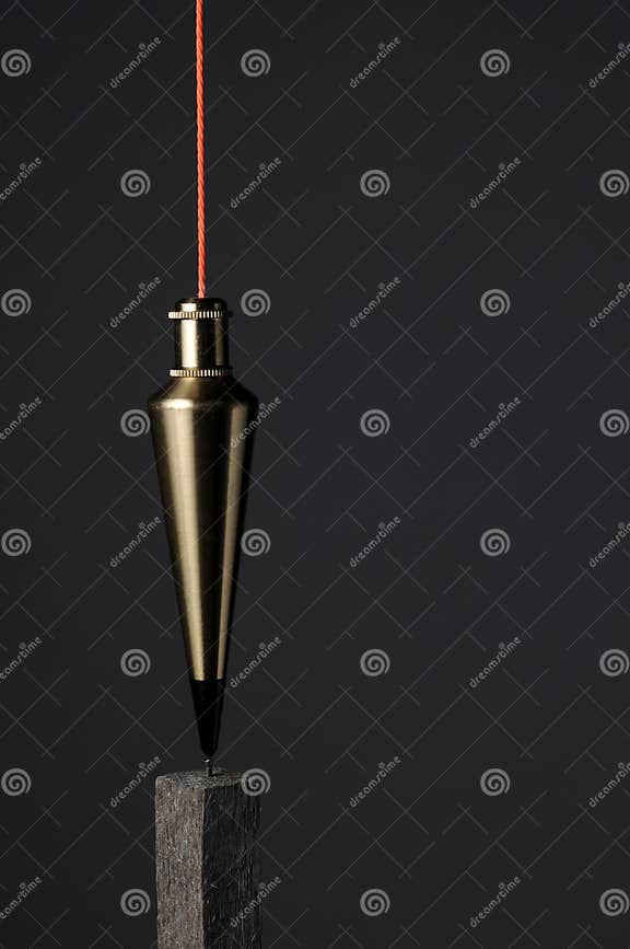 Plumb line on dark gray stock image. Image of wooden - 10064925