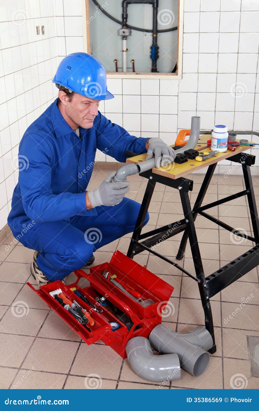 Plumber adjusting pipe stock image. Image of plumber - 35386569