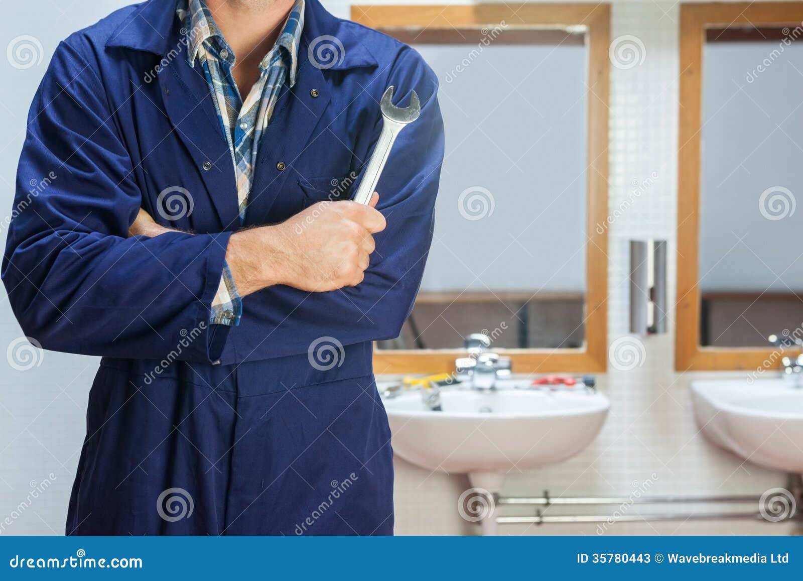 Plumber in Blue Boiler Suit Posing with Wrench Stock Image - Image of ...