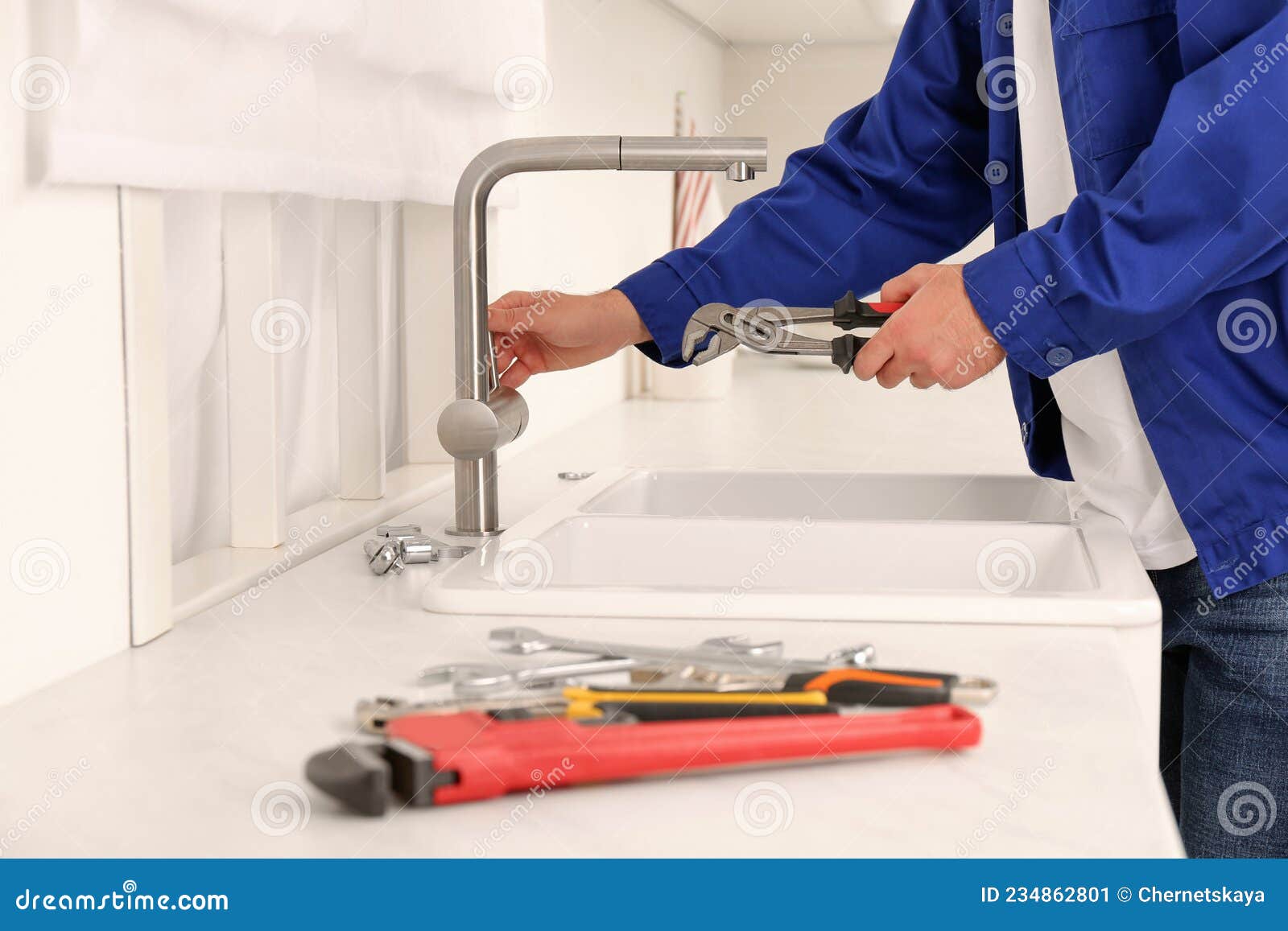 Plumber Checking Water Tap after Installation in Kitchen, Closeup Stock ...