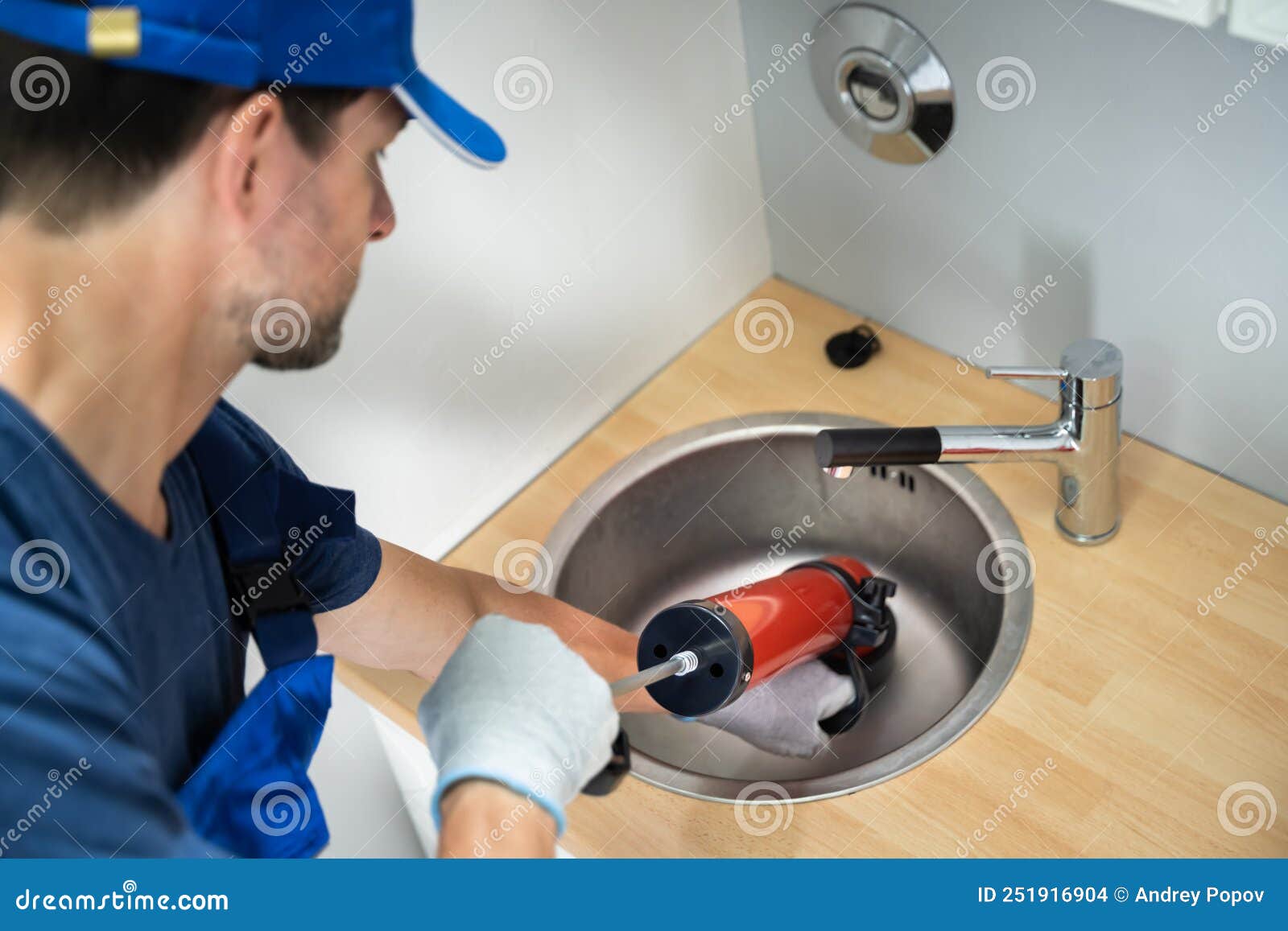 Plumber Cleaning Drain and Sink Stock Photo - Image of plunger, hand ...