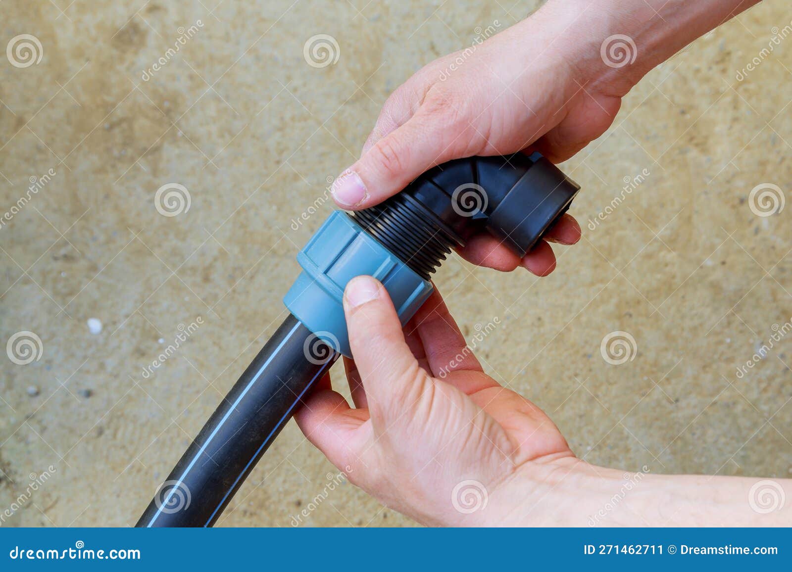 A Plumber Connects a Polyethylene Pipe Using a Special Fitting. Stock ...