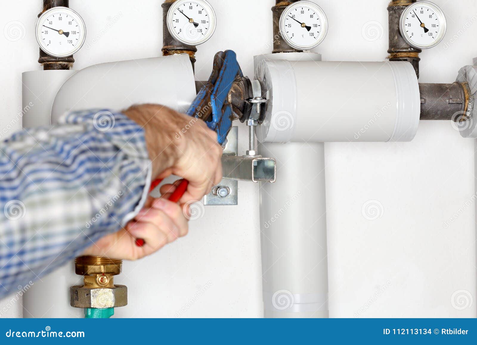 Plumber is fixing a pipe stock photo. Image of metal - 112113134
