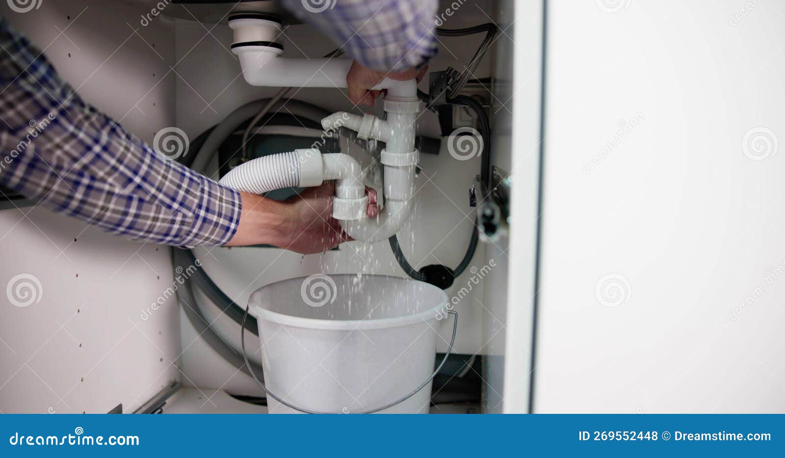 Plumber Fixing Pipe Leak stock photo. Image of leaking - 269552448