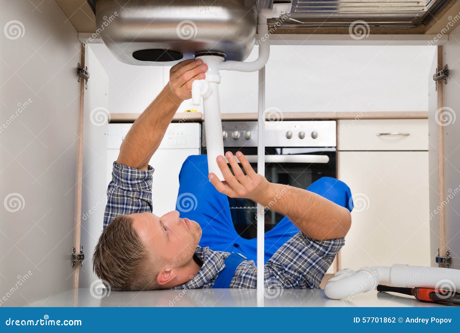 Plumber Fixing Pipe into the Sink Stock Photo - Image of maintenance ...