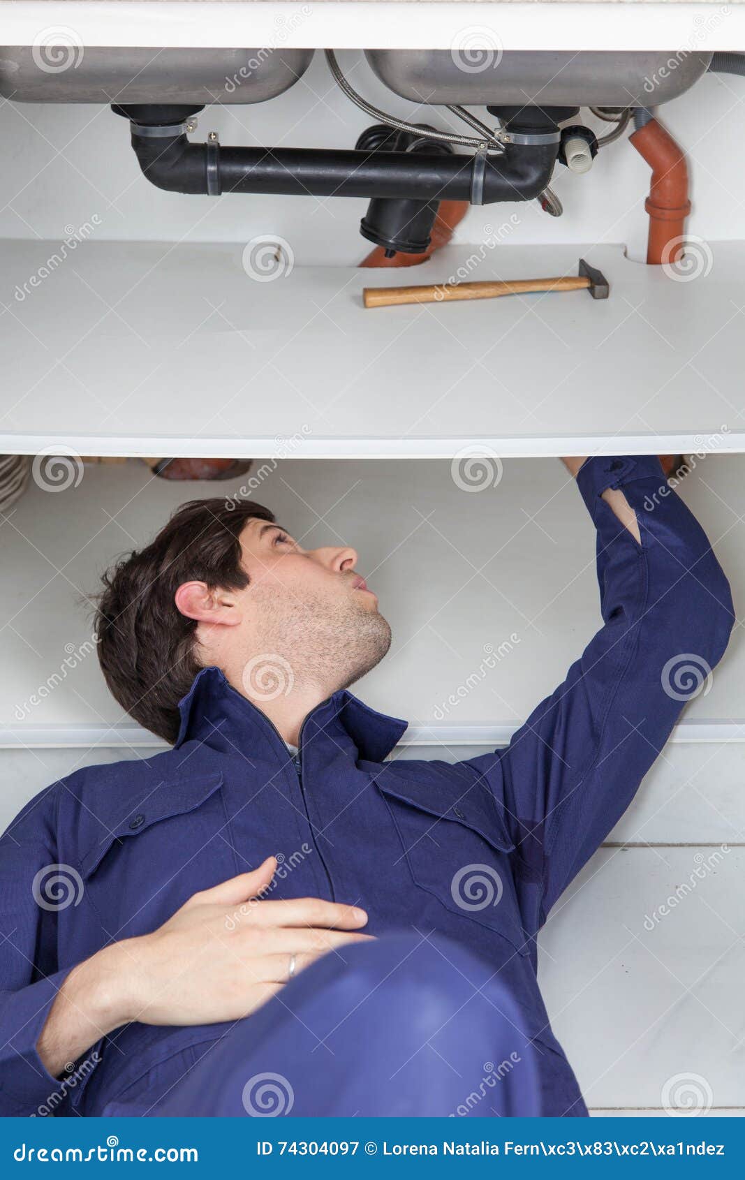 Plumber fixing the pipe stock image. Image of fixing - 74304097