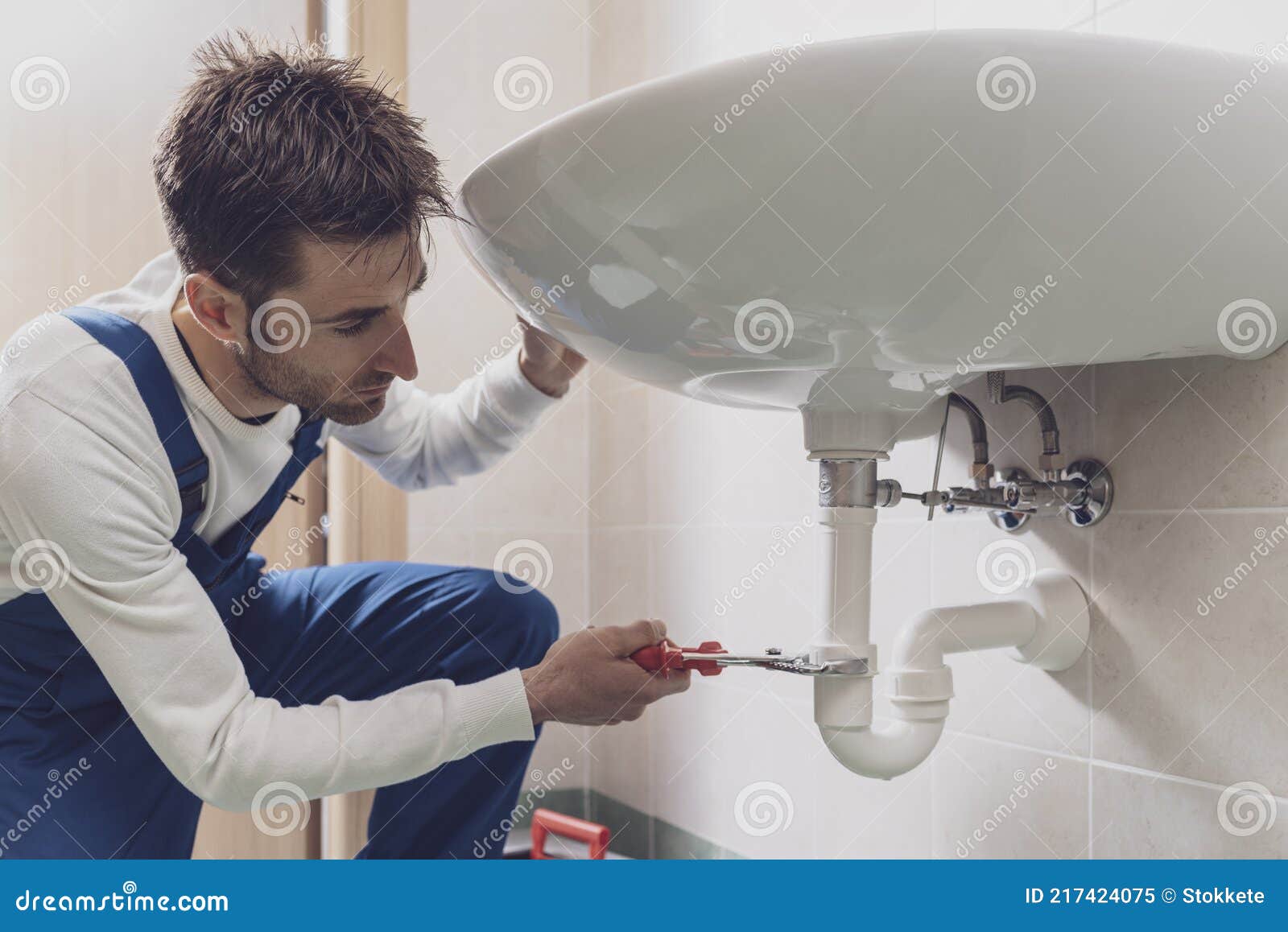 Plumber Fixing a Sink at Home Stock Image - Image of service, plumbing ...