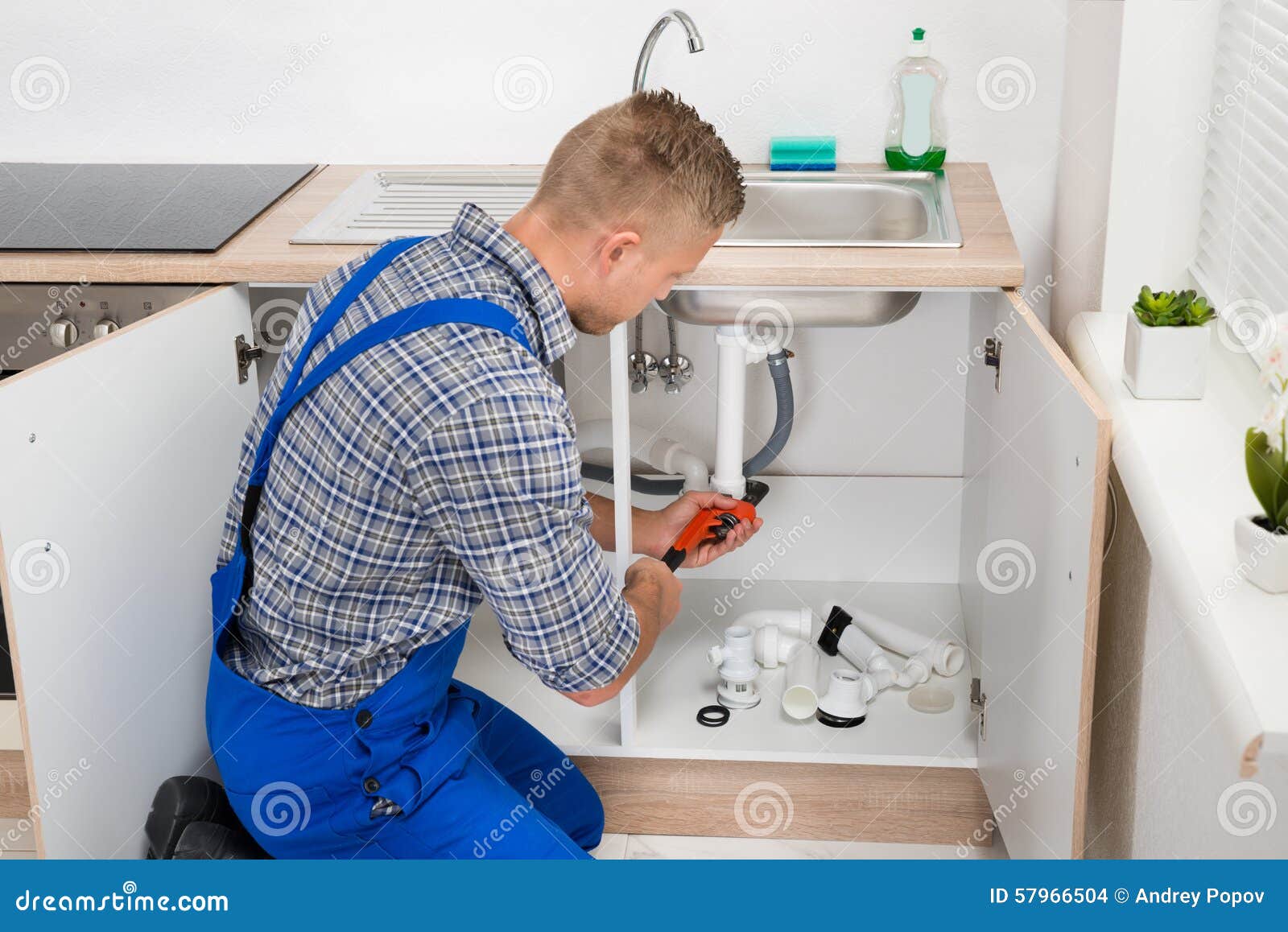 Plumber Fixing Sink Pipe stock photo. Image of handyman - 57966504