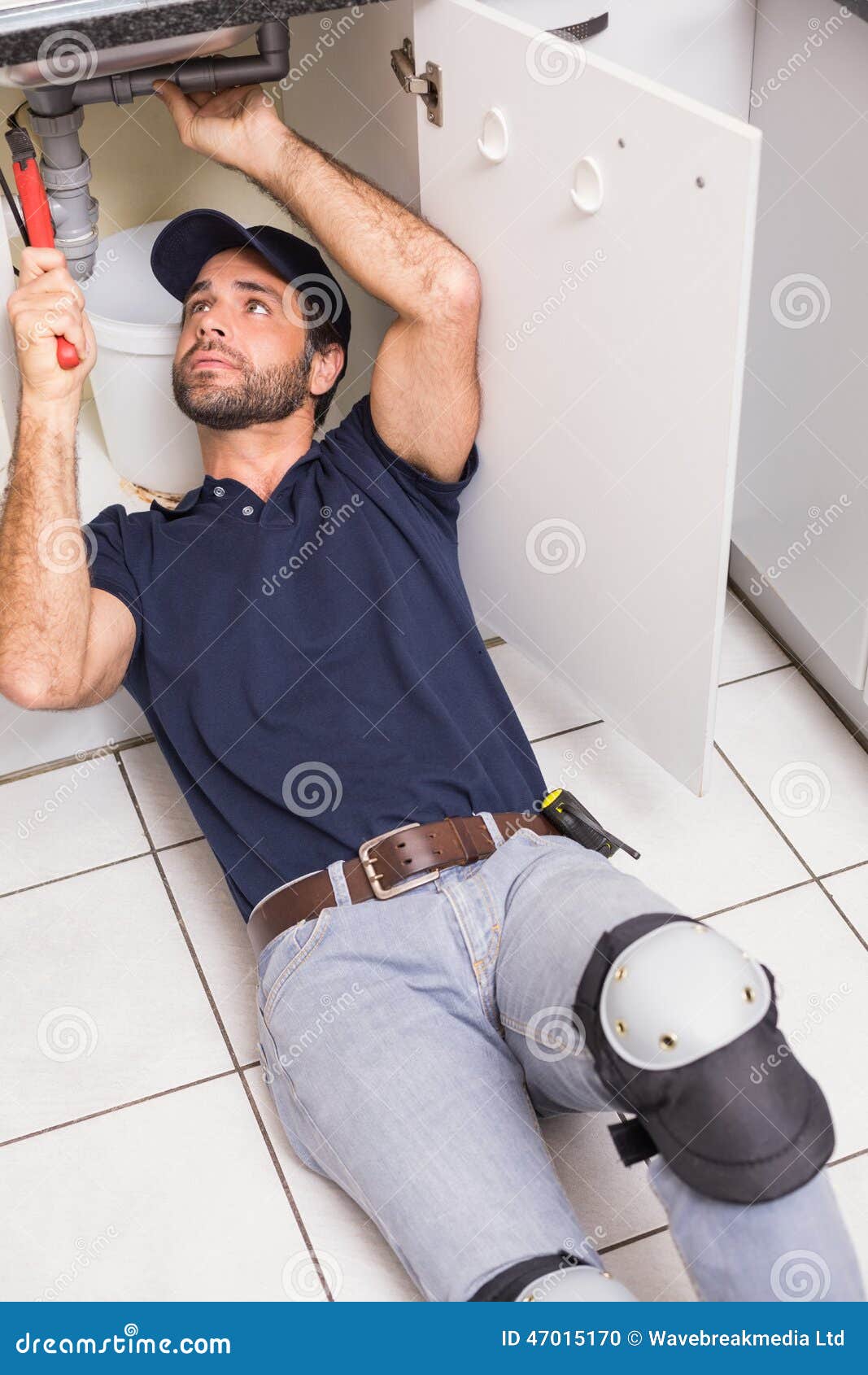Plumber Fixing Under the Sink Stock Photo - Image of holding, plumbing ...