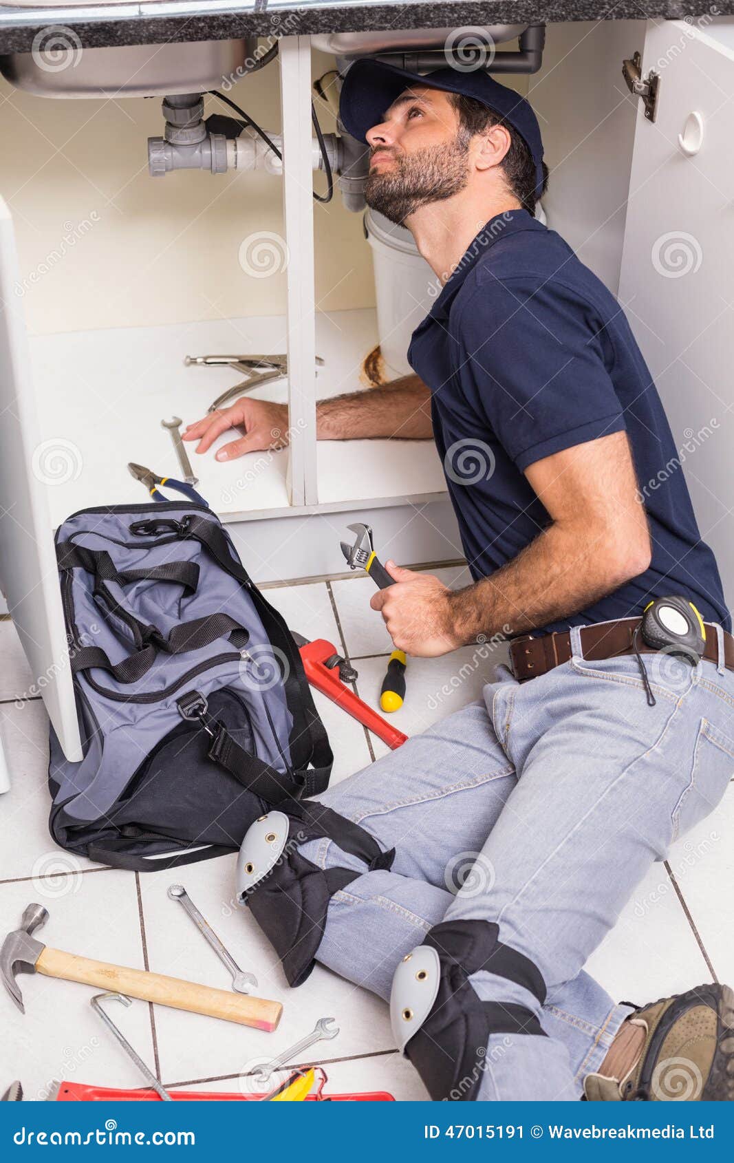Plumber Fixing Under the Sink Stock Image - Image of lying, wrench ...