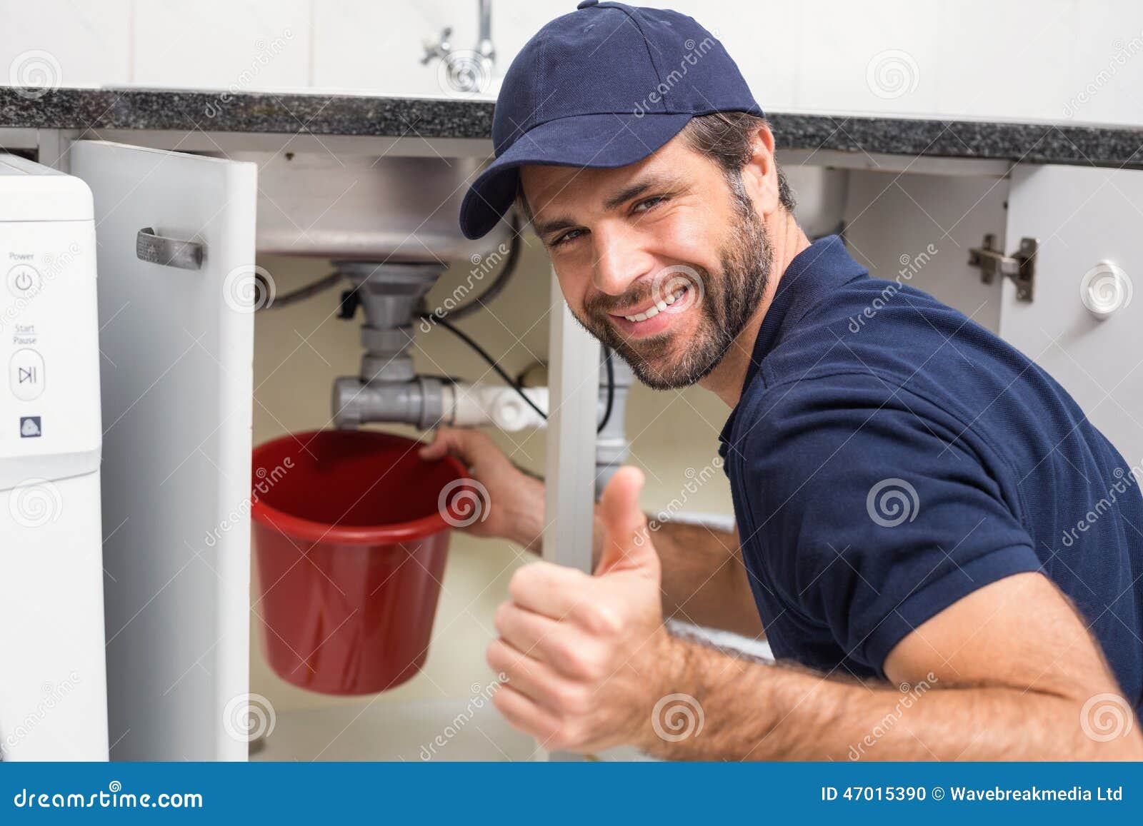 Plumber Fixing Under the Sink Stock Photo - Image of happy, tool: 47015390