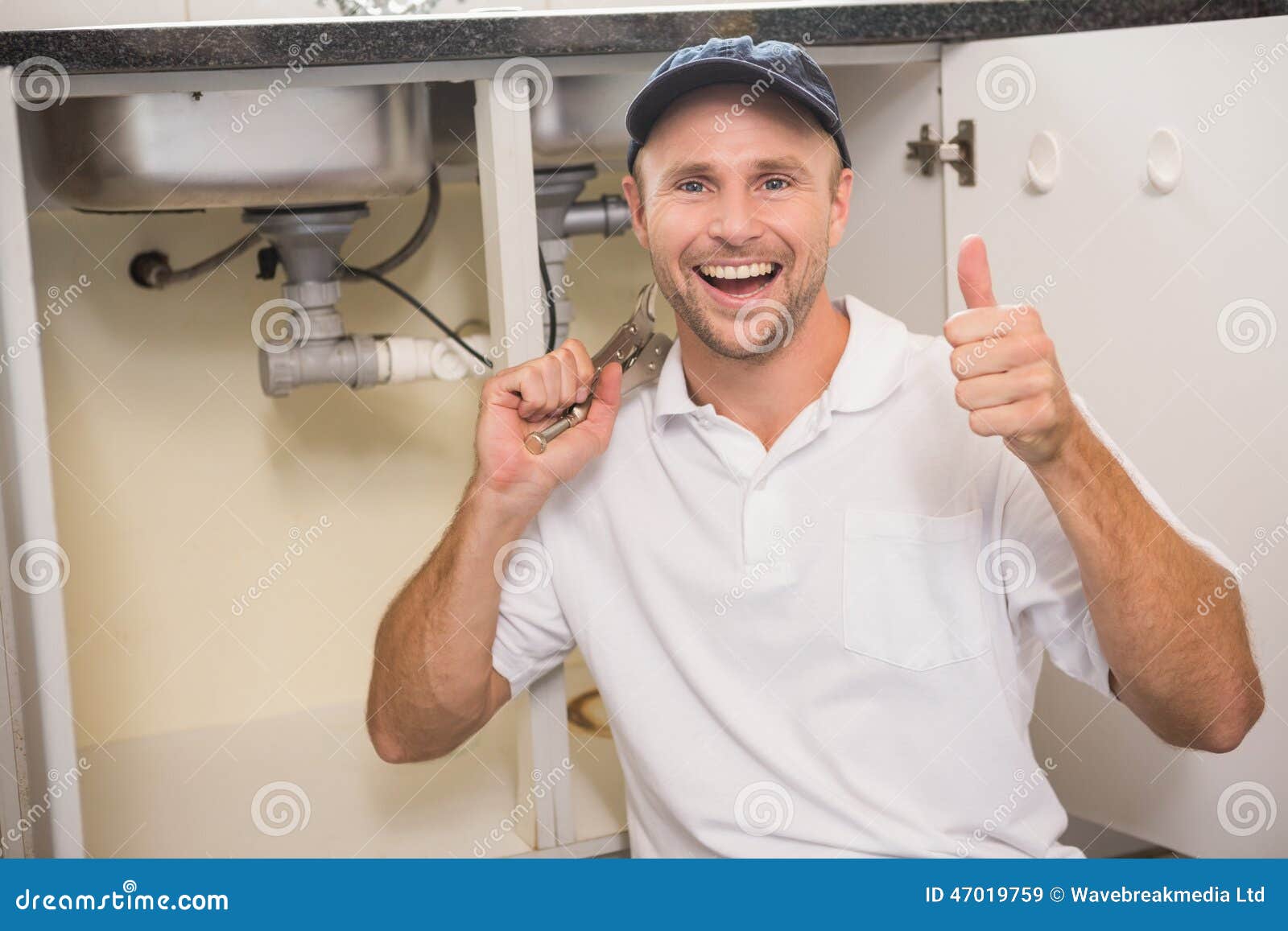 Plumber Fixing Under the Sink Stock Image - Image of profession ...