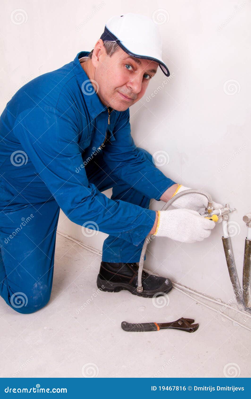 Plumber fixing water pipe stock photo. Image of pipe - 19467816