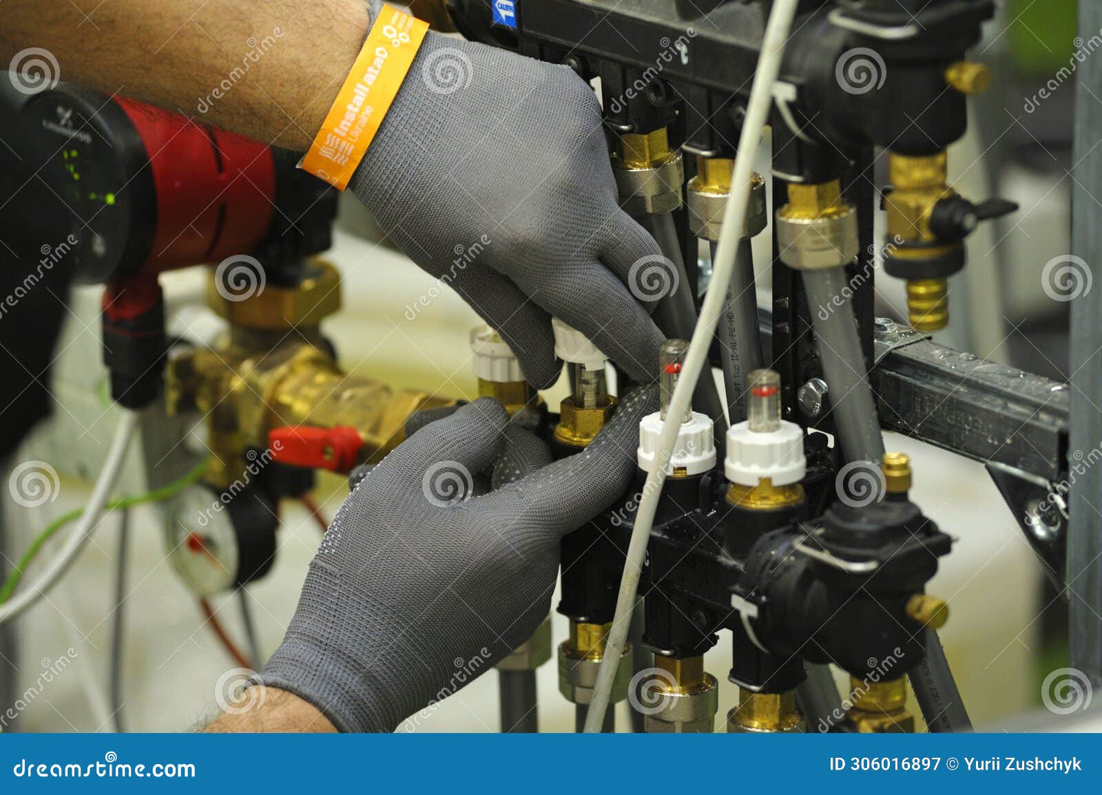 Plumber Hands Assembling Heating Manifold of a House Heating System ...
