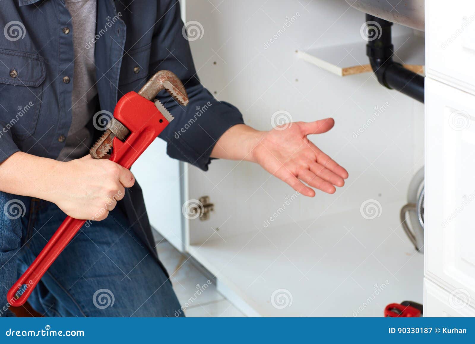 Plumber hands with wrench. stock image. Image of hand - 90330187