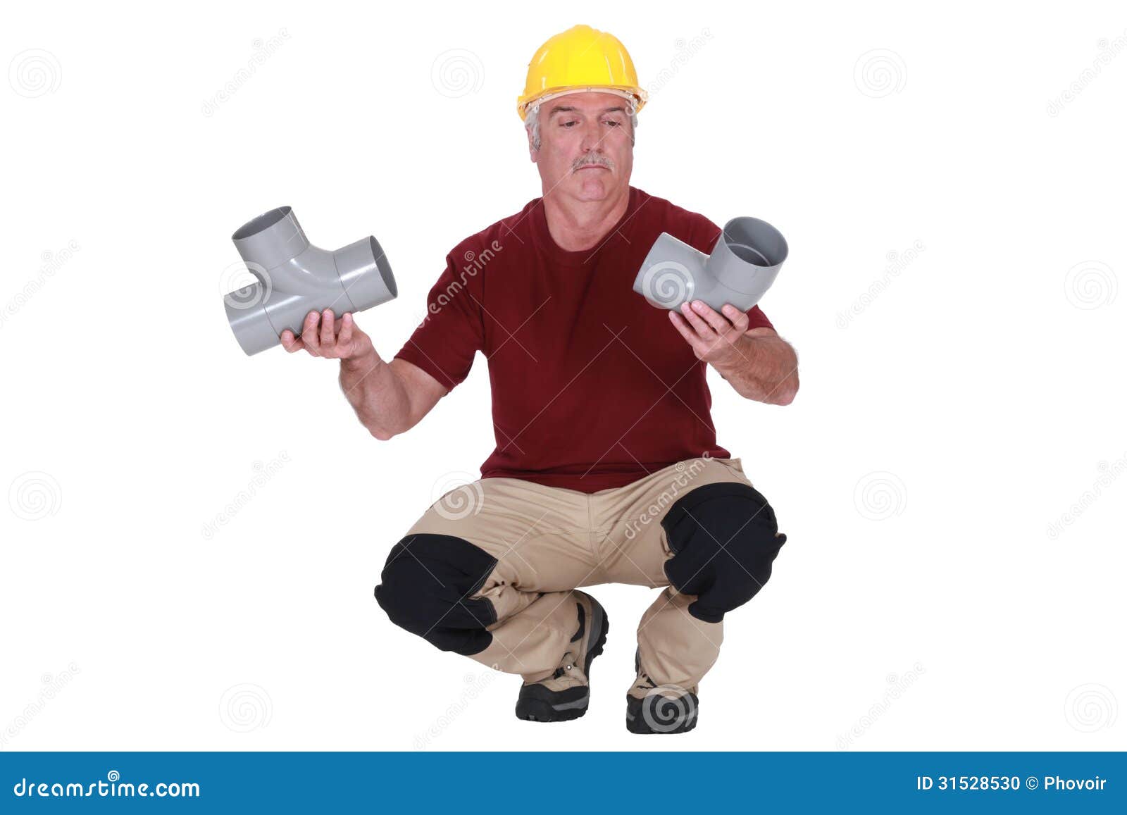 Plumber holding two pipes stock photo. Image of closeup - 31528530