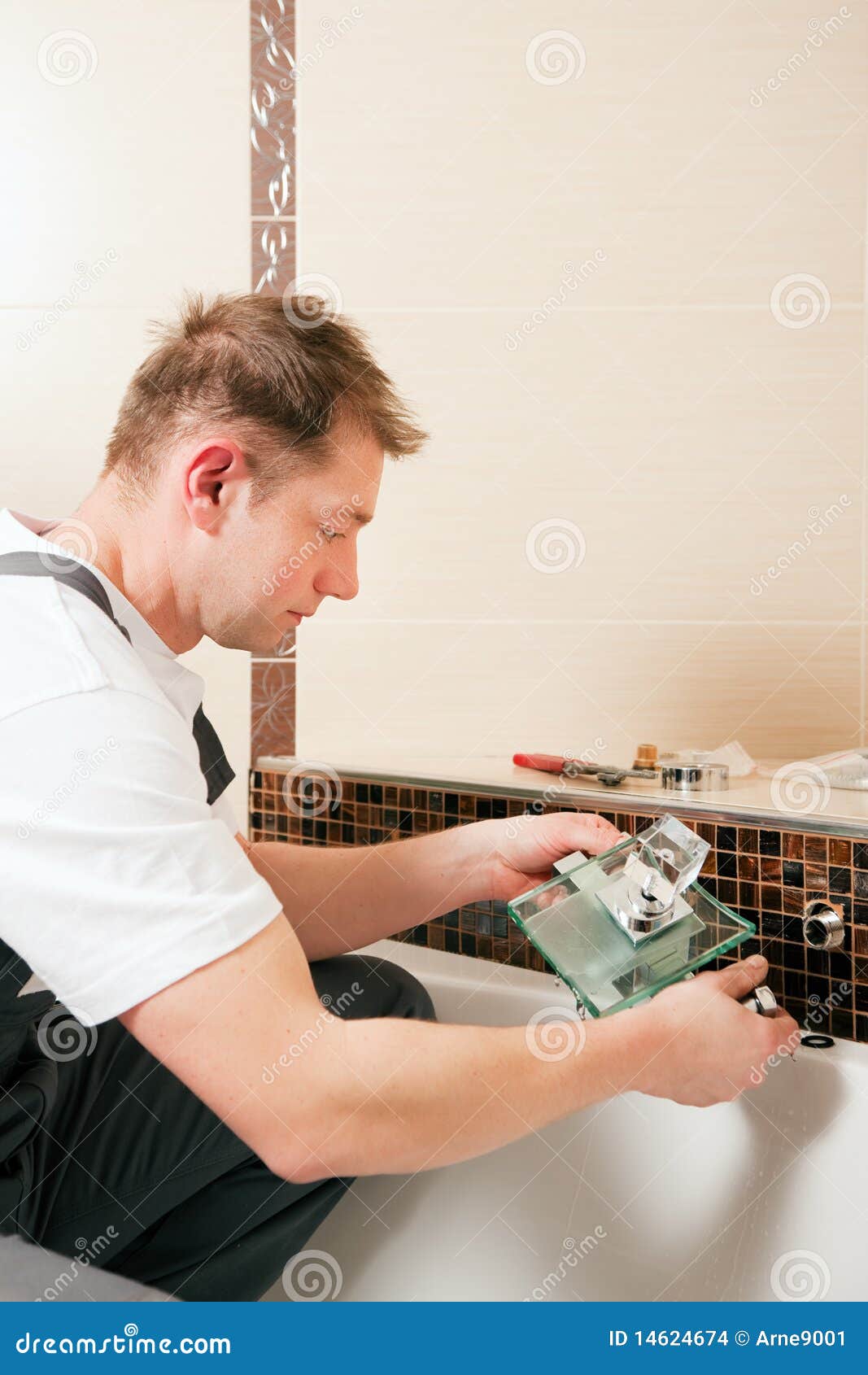 Plumber Installing a Mixer Tap in a Bathroom Stock Photo - Image of ...
