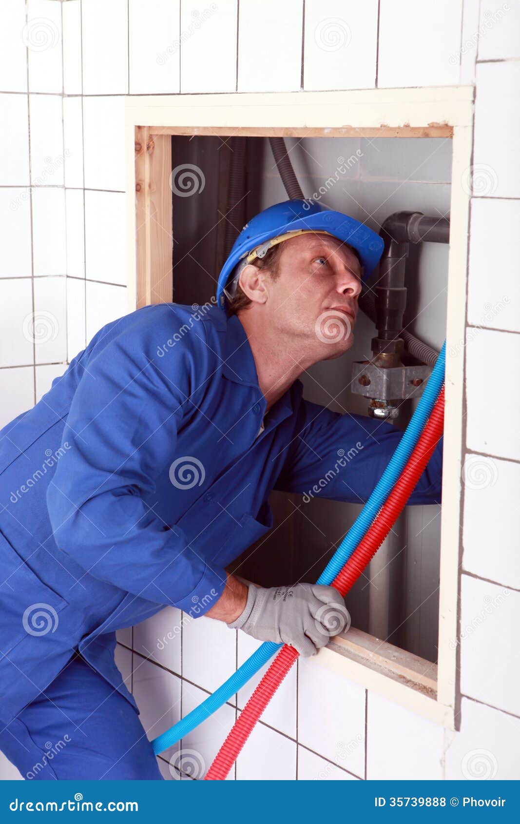 Plumber installing pipes stock photo. Image of making - 35739888