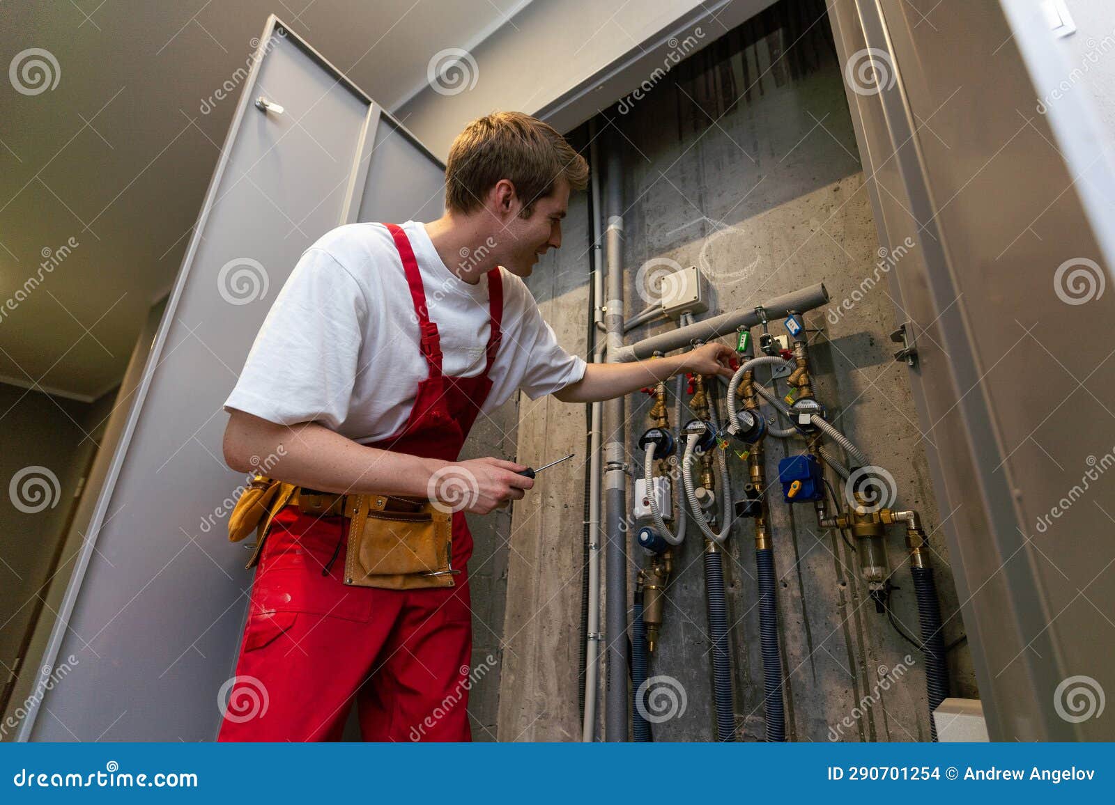 Plumber Installing Pressure Meter for House Heating System Stock Photo ...
