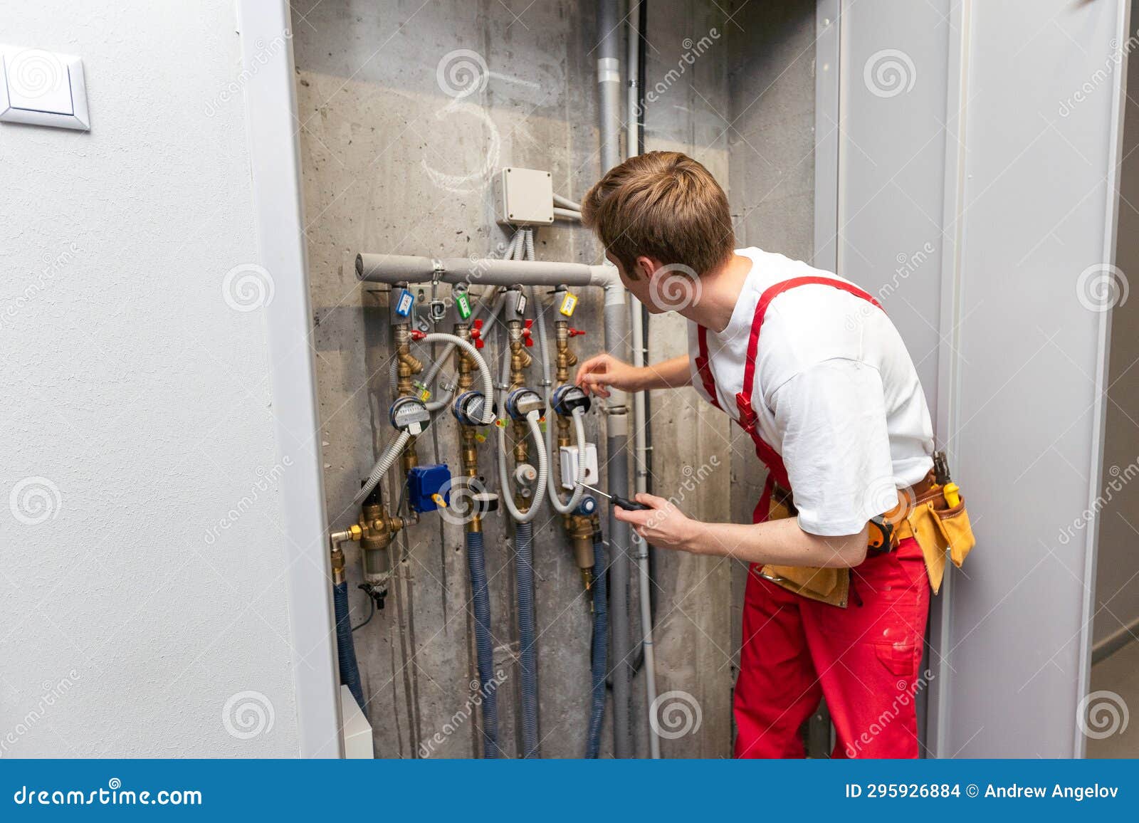 Plumber Installing Pressure Meter for House Heating System Stock Photo ...