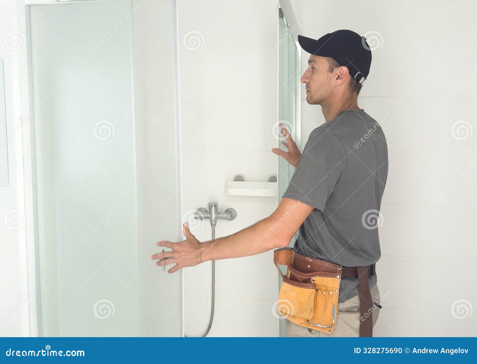 Plumber Installing a Shower Cabin in Bathroom Stock Photo - Image of ...