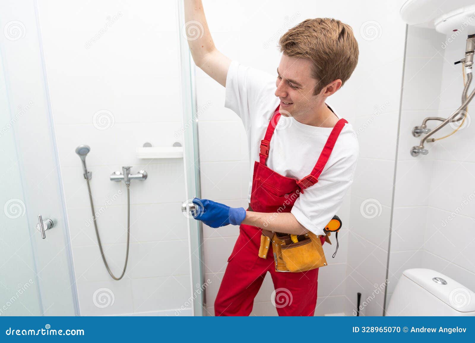 Plumber Installing a Shower Cabin in Bathroom Stock Photo - Image of ...