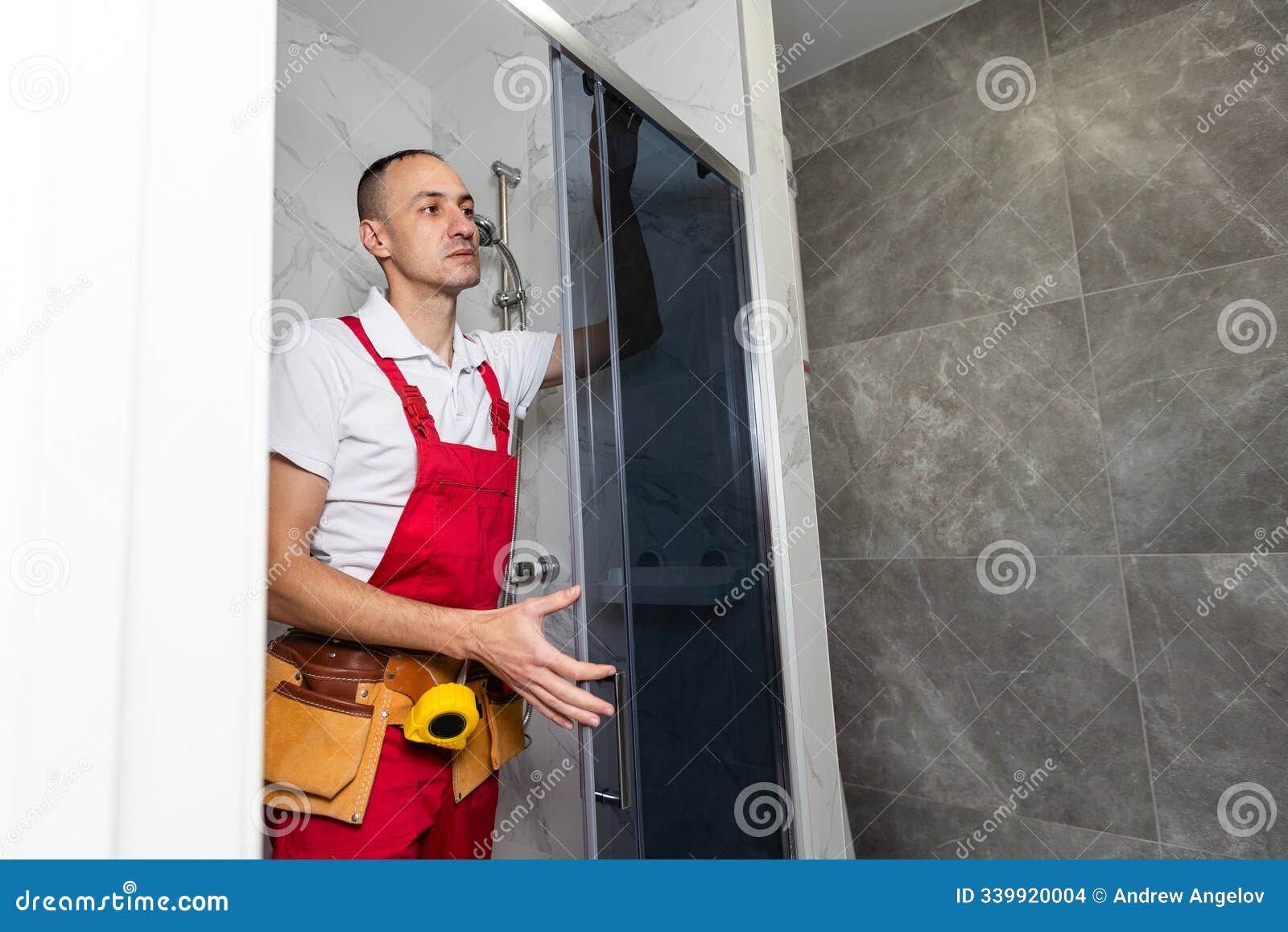 Plumber Installing a Shower Cabin in Bathroom Stock Photo - Image of ...