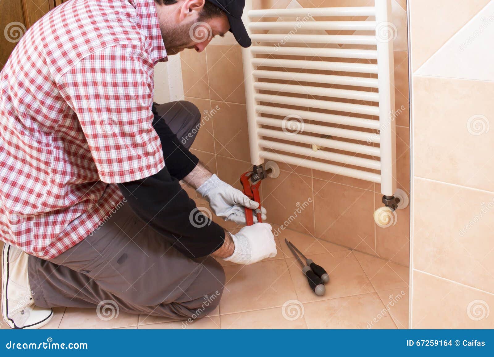 Plumber Installing a Thermostatic Valve Stock Photo - Image of ...