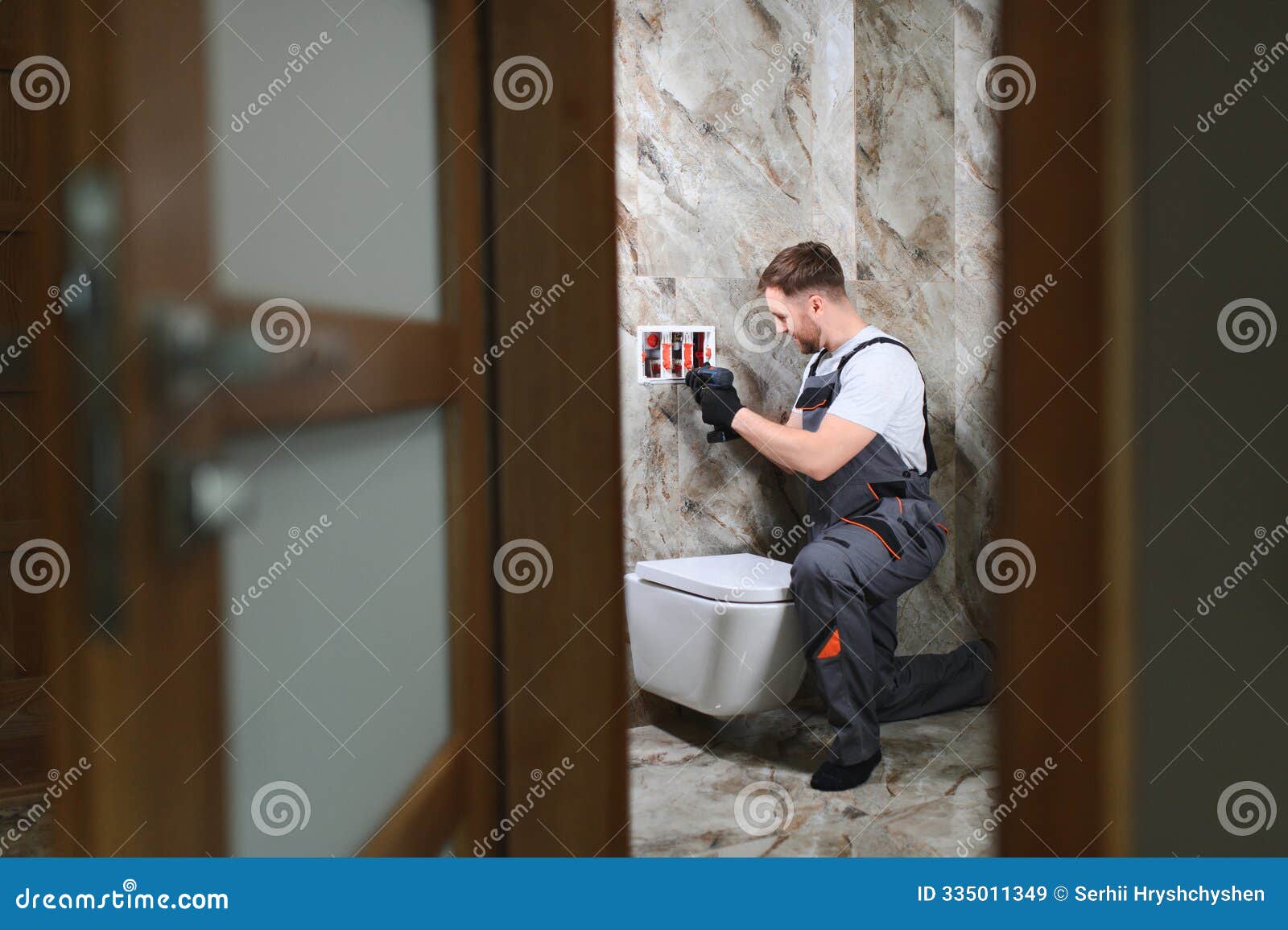 Plumber Installing Toilet in Restroom Stock Image - Image of ...