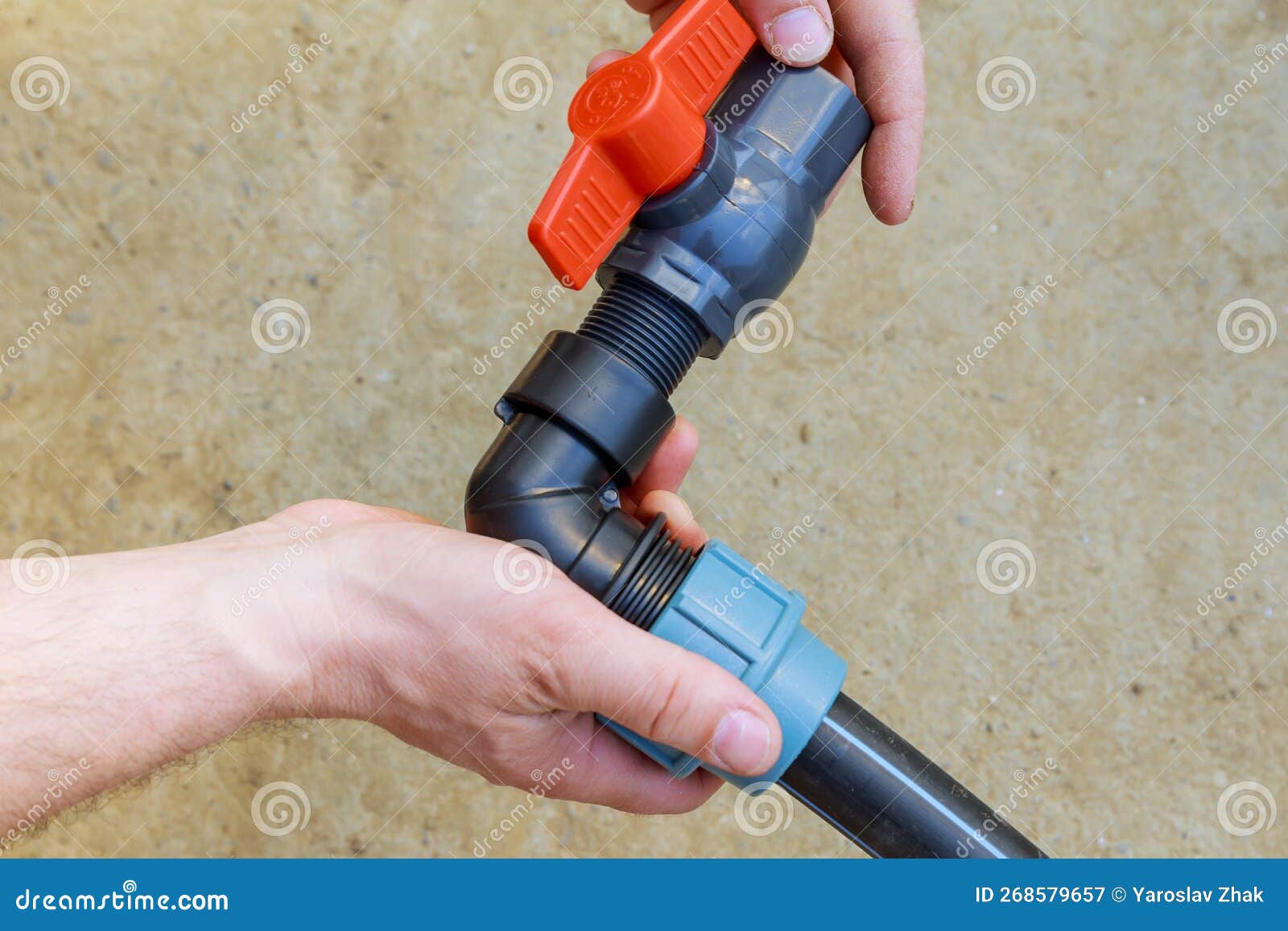 A Plumber Installs a Faucet on a Polyethylene Pipe. Stock Image - Image ...