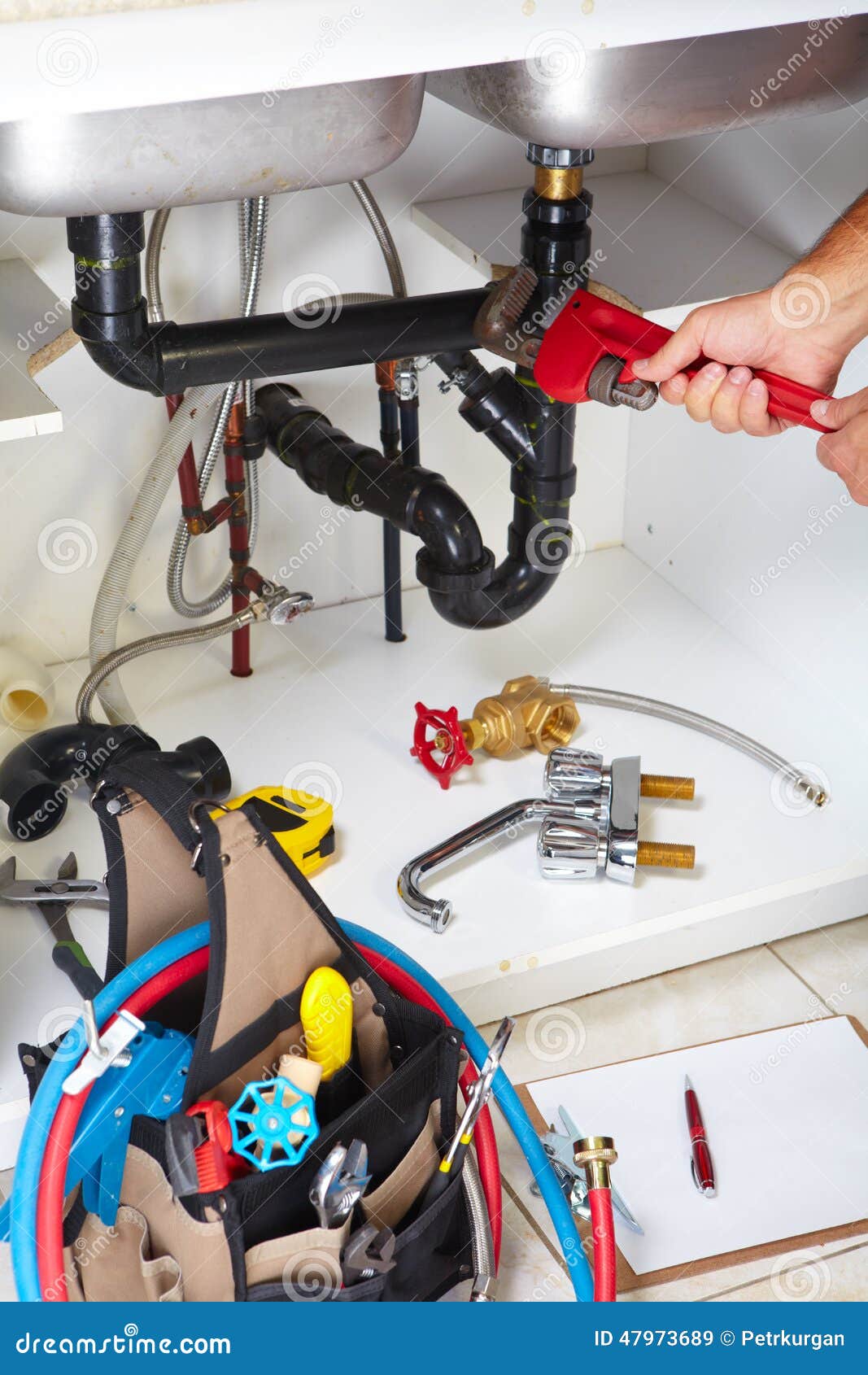 Plumber on the kitchen. stock image. Image of hand, plumbing - 47973689