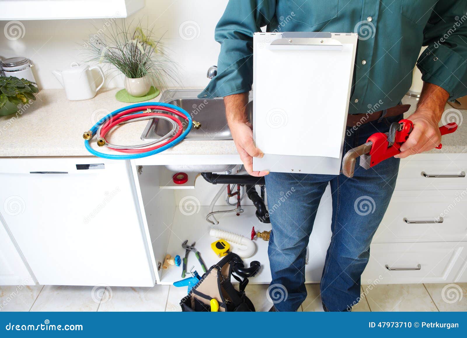 Plumber on the kitchen. stock photo. Image of house, service - 47973710