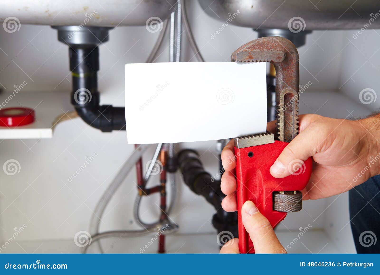 Plumber on the kitchen. stock photo. Image of copyspace - 48046236