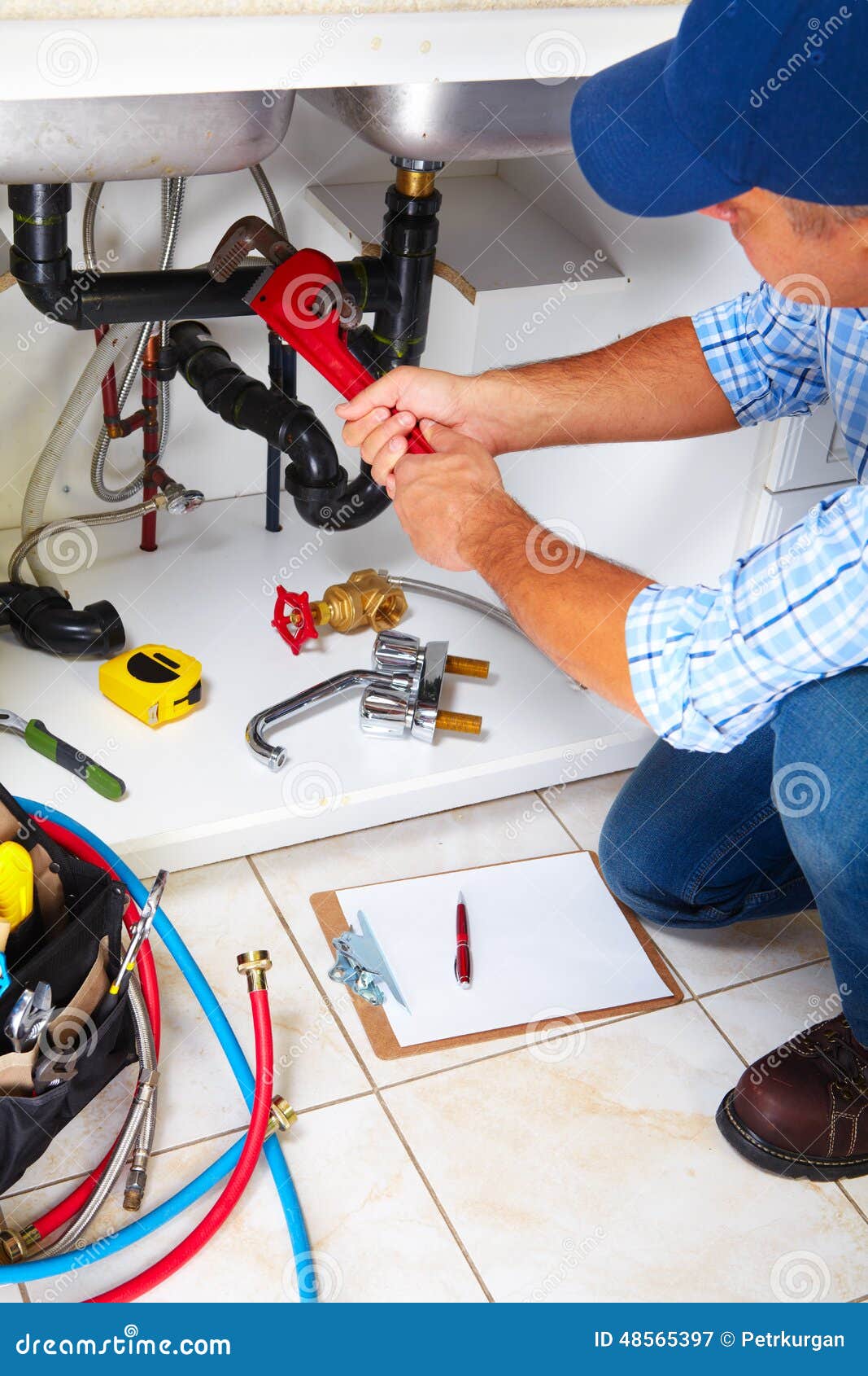 Plumber on the kitchen. stock image. Image of home, commercial - 48565397